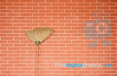 Broom Stick On Brick Wall Stock Photo - Royalty Free Image ID 10042024