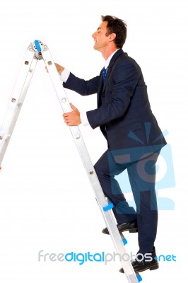 Business Man Climbing On Ladder Stock Photo - Royalty Free Image ID ...