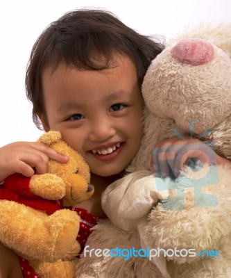 Child Hugging Toys Stock Photo - Royalty Free Image ID 10054920