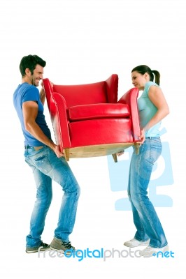 Couple Moving Armchair Stock Photo - Royalty Free Image ID 10036892