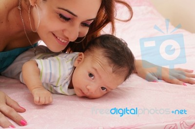 Hispanic Mother And Her Newborn Baby Stock Photo - Royalty Free Image ID 100200026