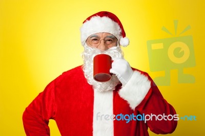 Relaxed Santa Enjoying His Cup Of Coffee Stock Photo - Royalty Free ...