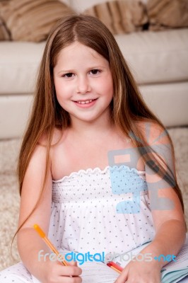 Small Girl Studying In Home Stock Photo - Royalty Free Image ID 10040184