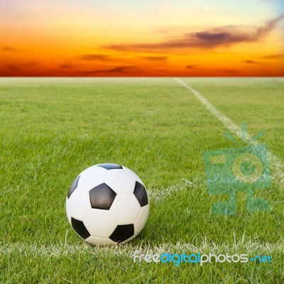 Soccer Ball On Soccer Field Against Sunset Sky Stock Photo - Royalty ...