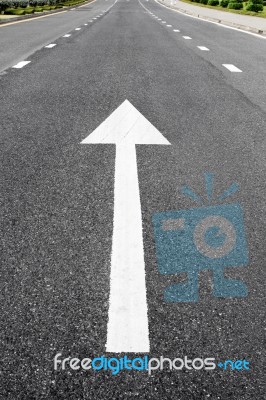 Straight Arrow Sign On Road Stock Photo - Royalty Free Image ID 100106523