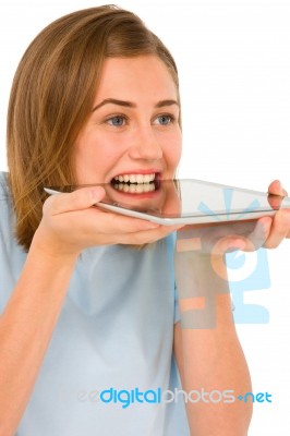 Teenage Girl Biting Tablet Pc Stock Photo - Royalty Free Image ID 100105718