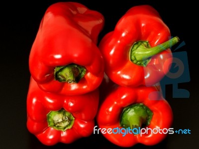 Top View Of Wet Red Peppers On Black Background Stock Photo - Royalty ...